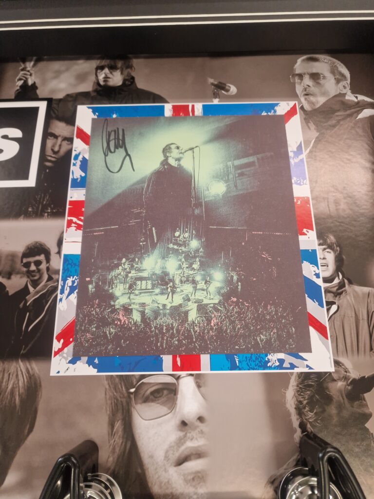 Oasis Liam Gallagher Signed Photo with Tambourine – Signed Memorabila Shop